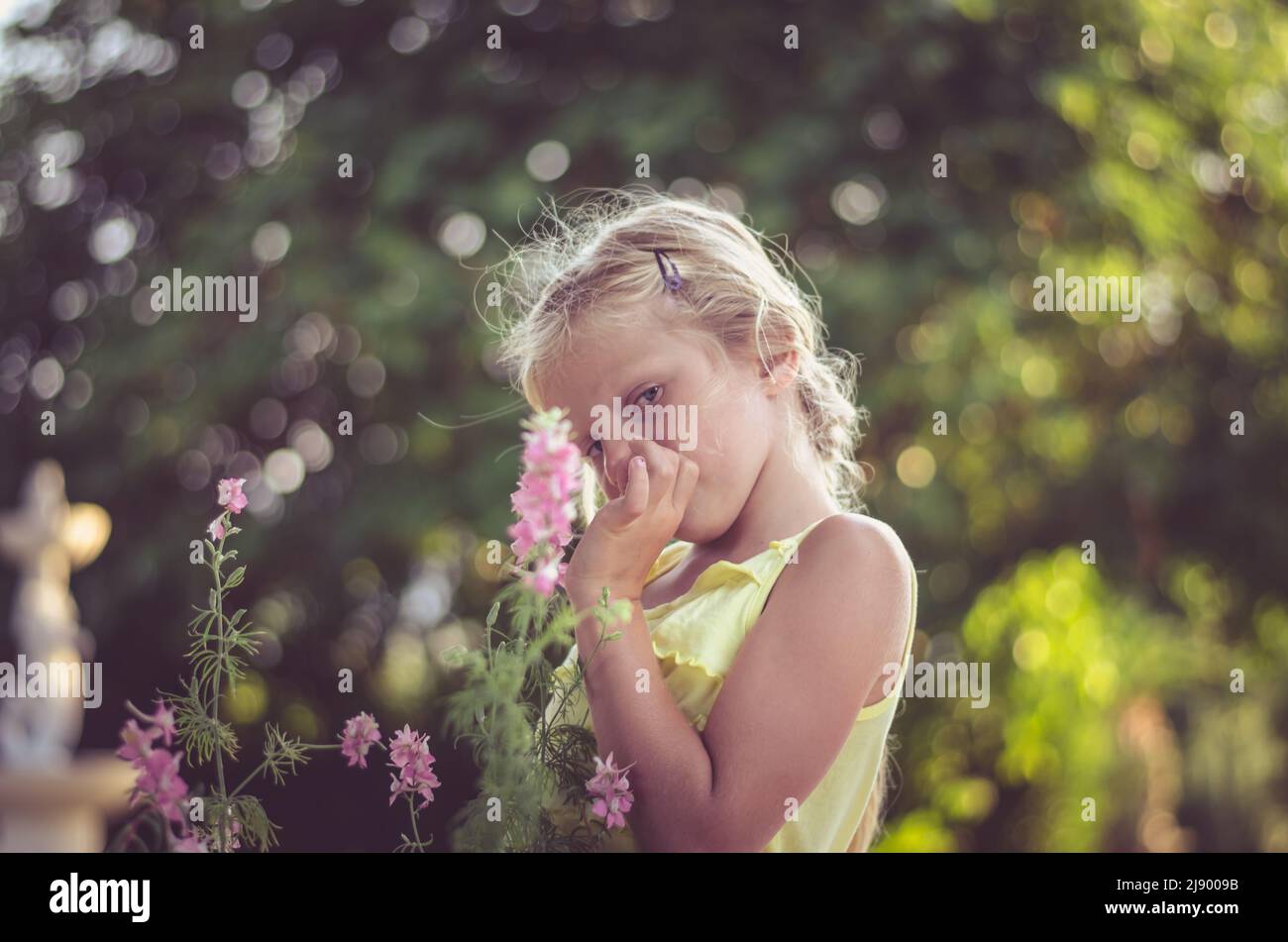 romantic child with pink flowers portrait Stock Photo - Alamy