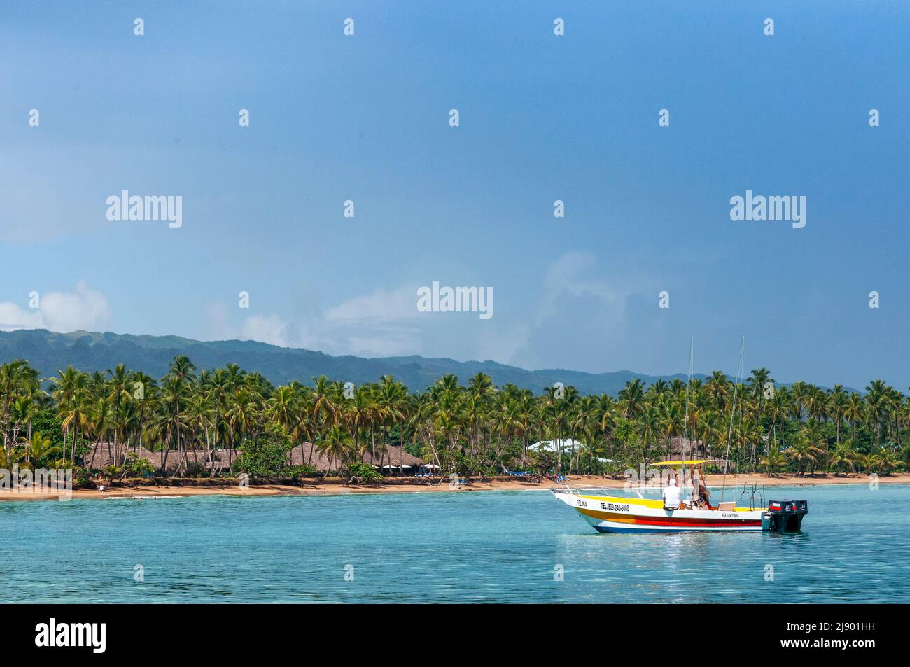Boats in the beach front of Playa bonita beach on the Samana peninsula ...