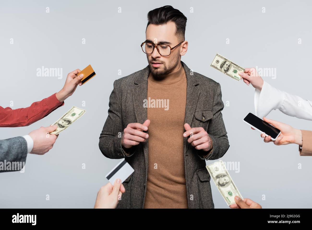 people with money, credit cards and mobile phone near young critic ...