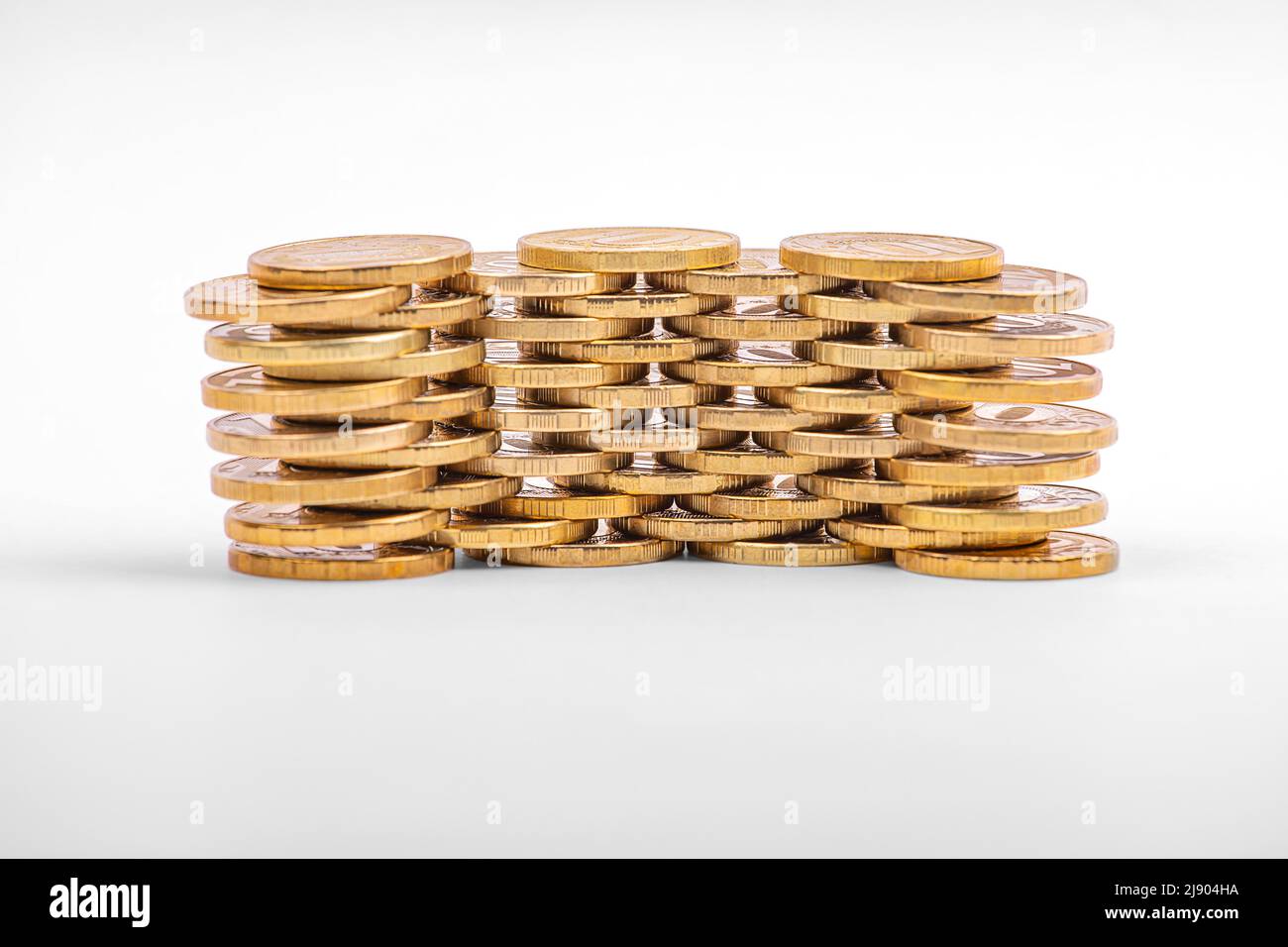 Stacks of gold coins in staggered order, close-up Stock Photo - Alamy