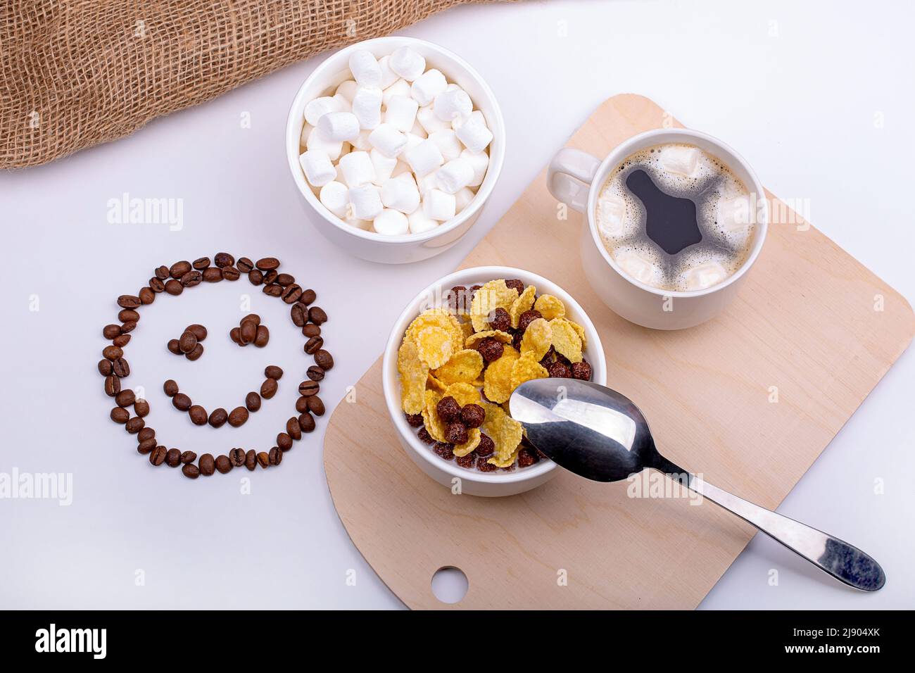 Good breakfast. Cereal with milk, coffee with marshmallows and a ...