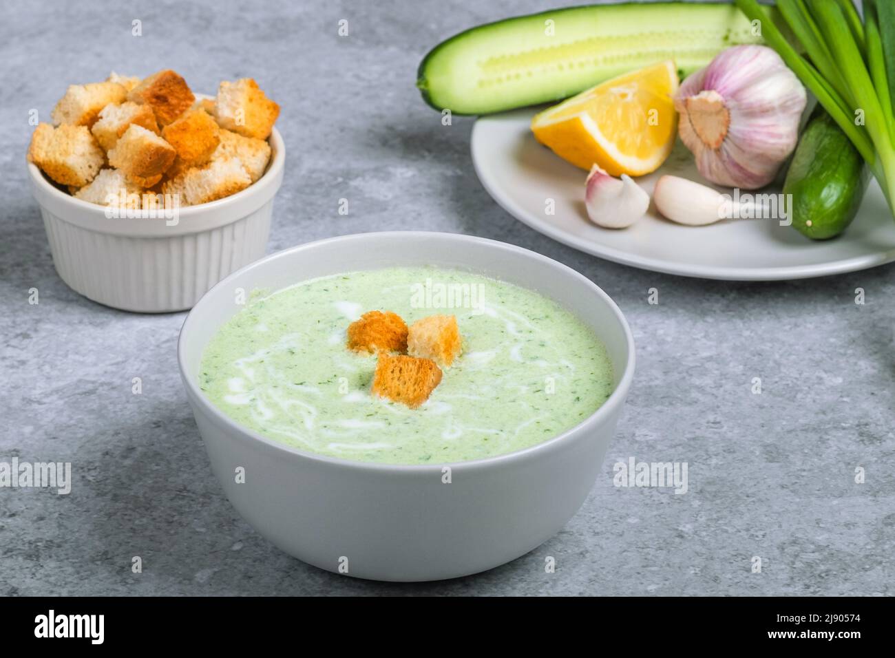 Vegan cream cold soup with cucumber, yogurt, garlic, herbs, lemon and ...