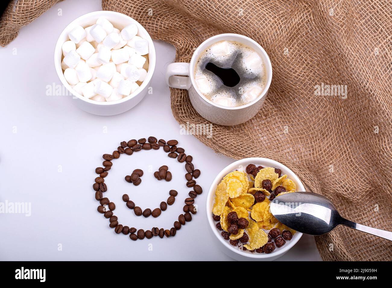 Good breakfast. Cereal with milk, coffee with marshmallows and a ...