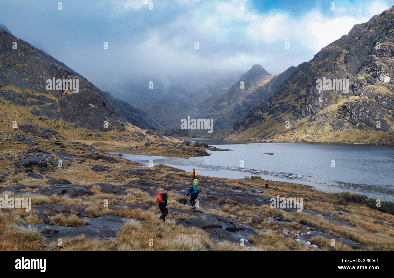 The Walkers at Loch Coruisk on Skye Stock Photo - Alamy