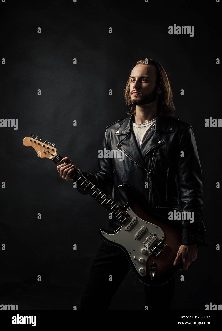 cool. masterfully playing rock music. stylish crazy man. string musical ...