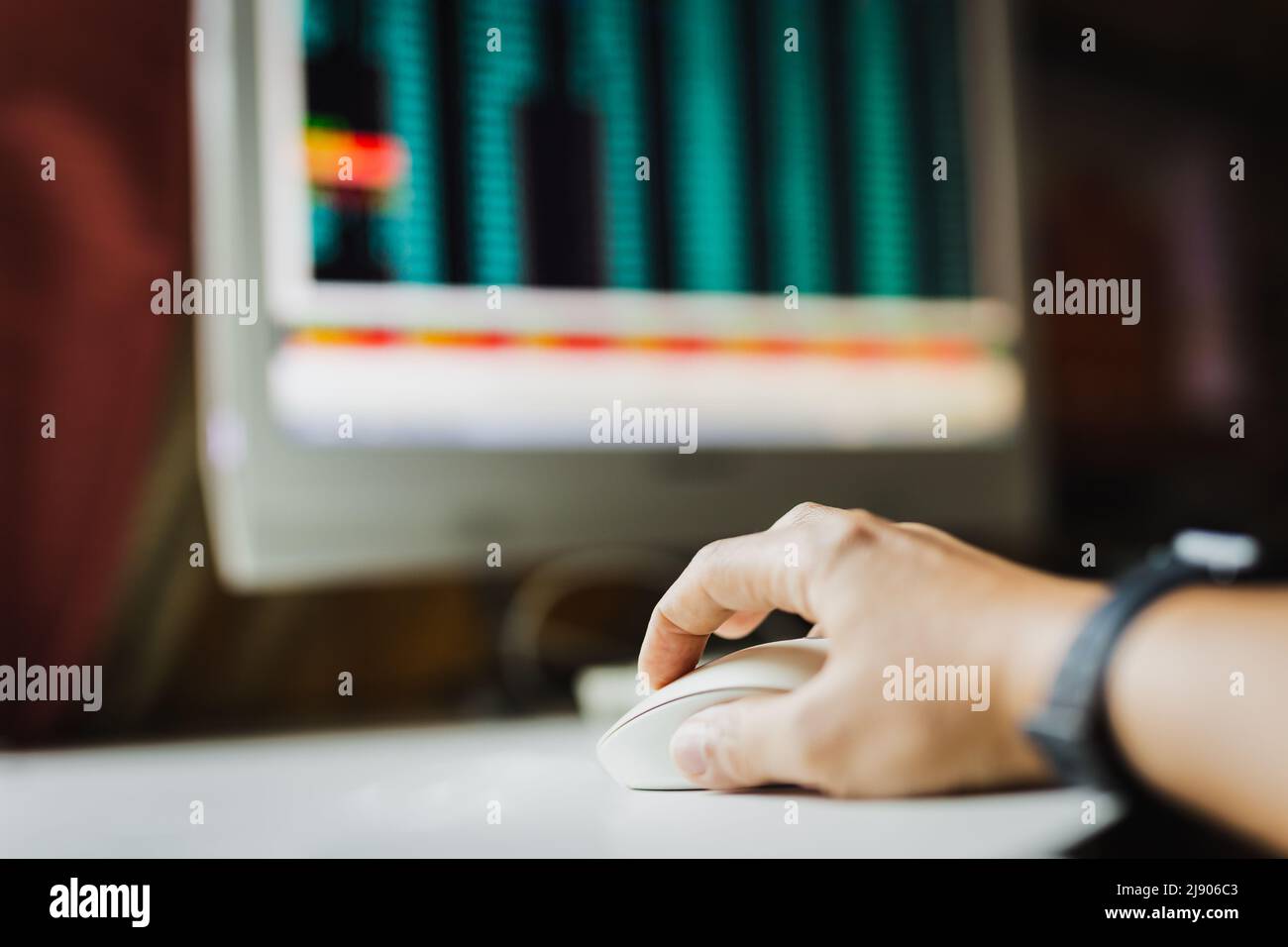 Male hand holding computer mouse with PC screen in background Stock ...