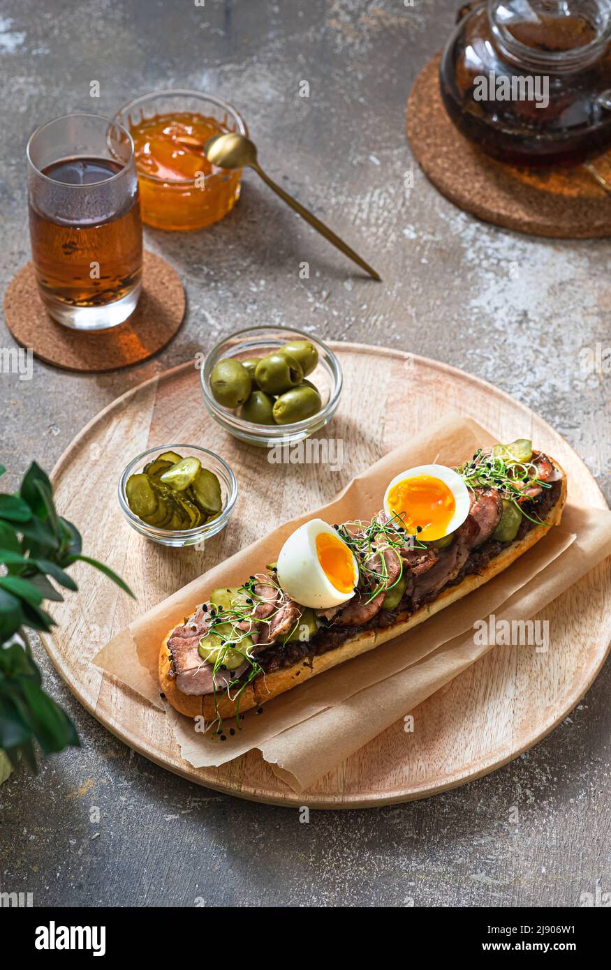 Homemade sandwich with turkey, pickles and egg for breakfast, copy ...