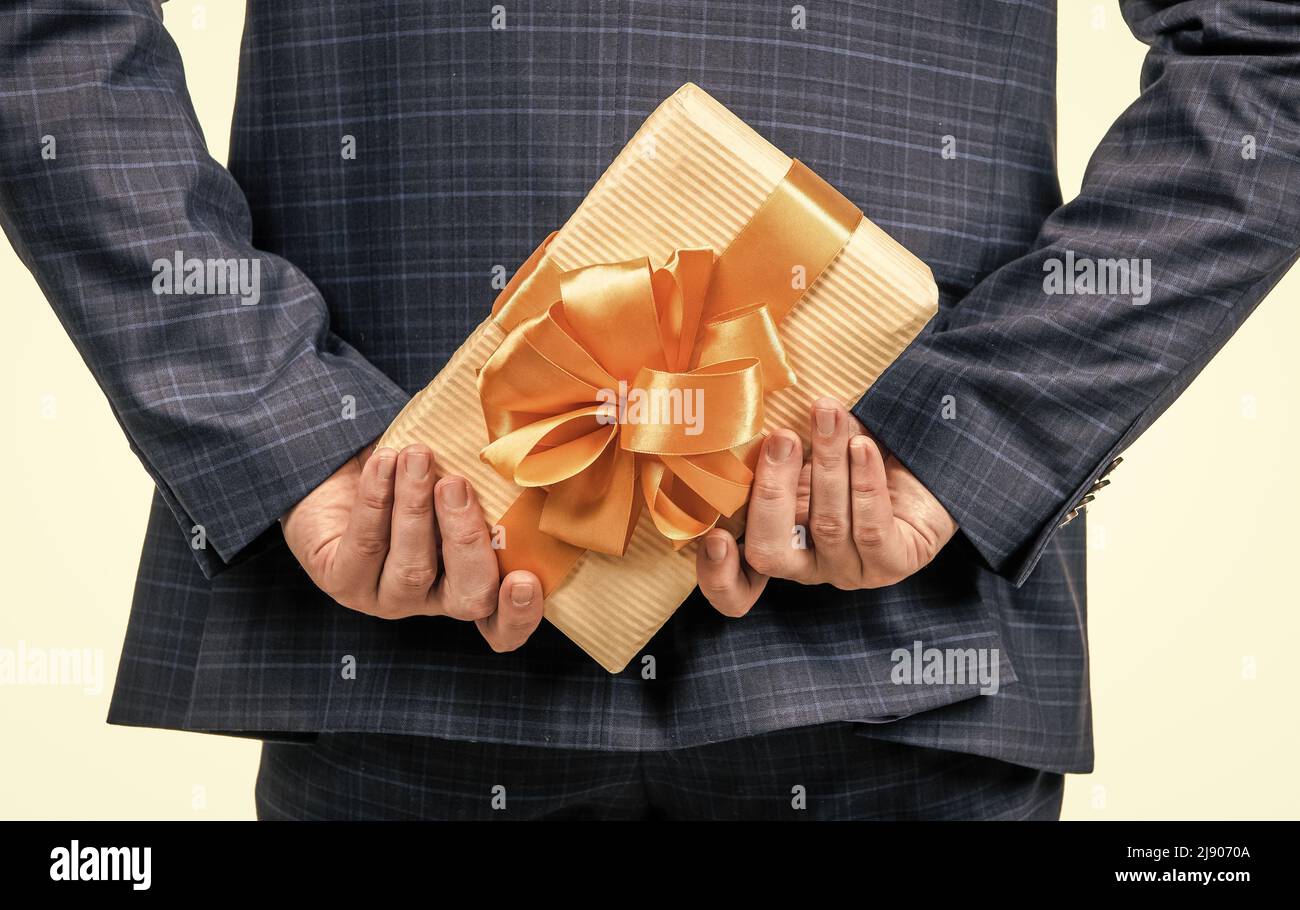 cropped businessman man hiding present box, back view, surprise Stock ...