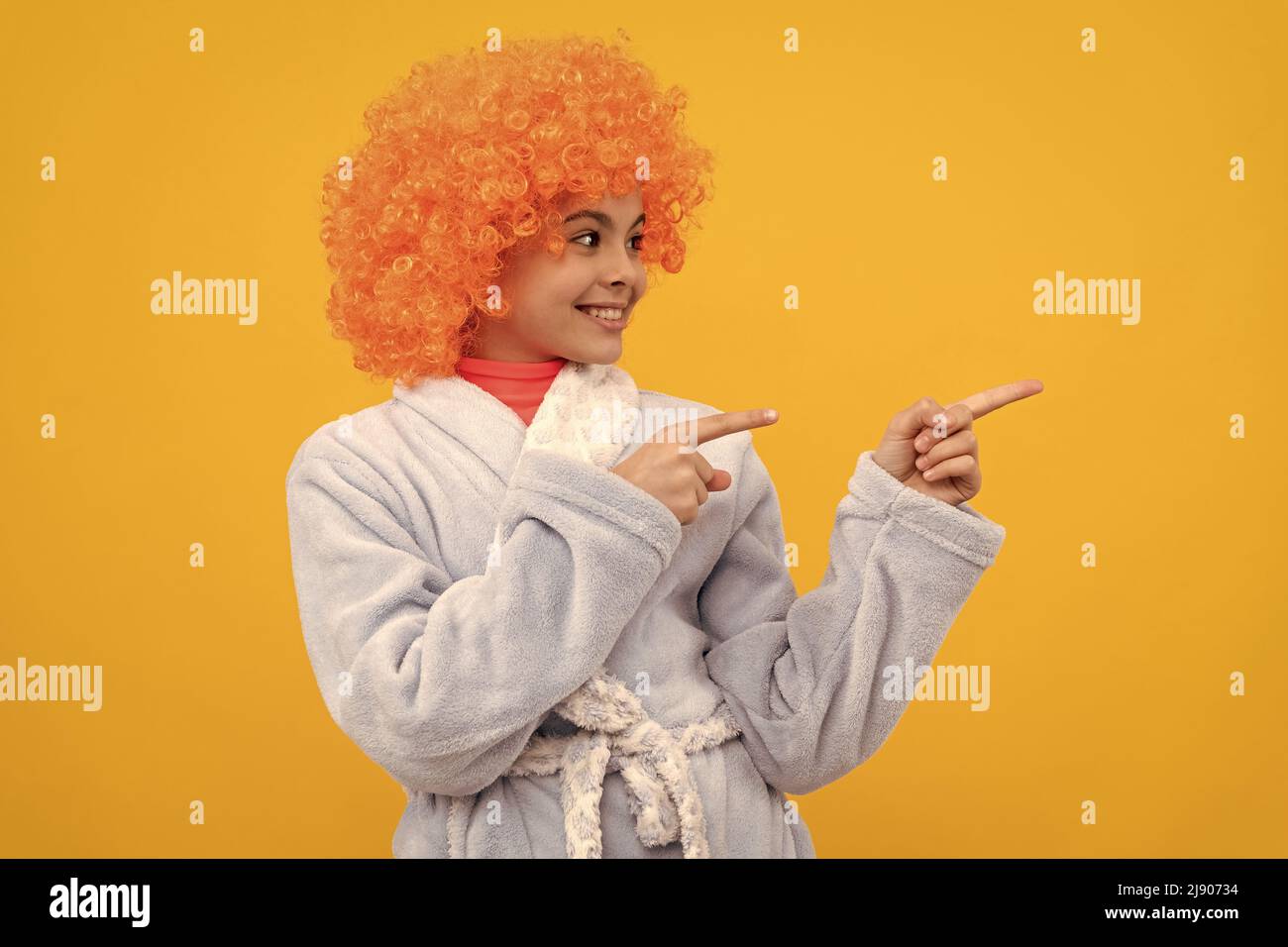 fancy child in home bathrobe. happy teen girl with orange hair in cozy ...