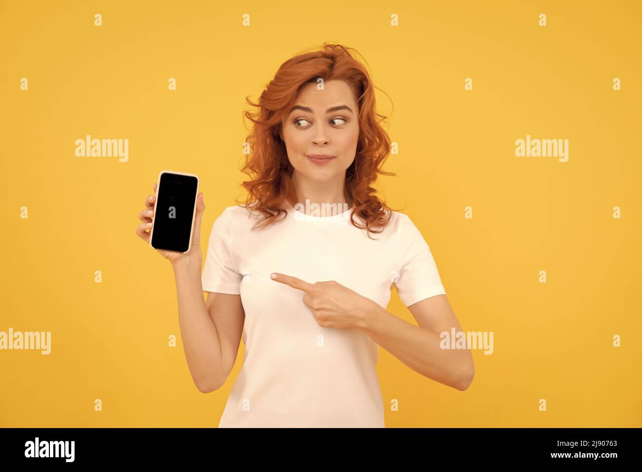 Packed with features. pointing finger cell phone. show mobile device ...