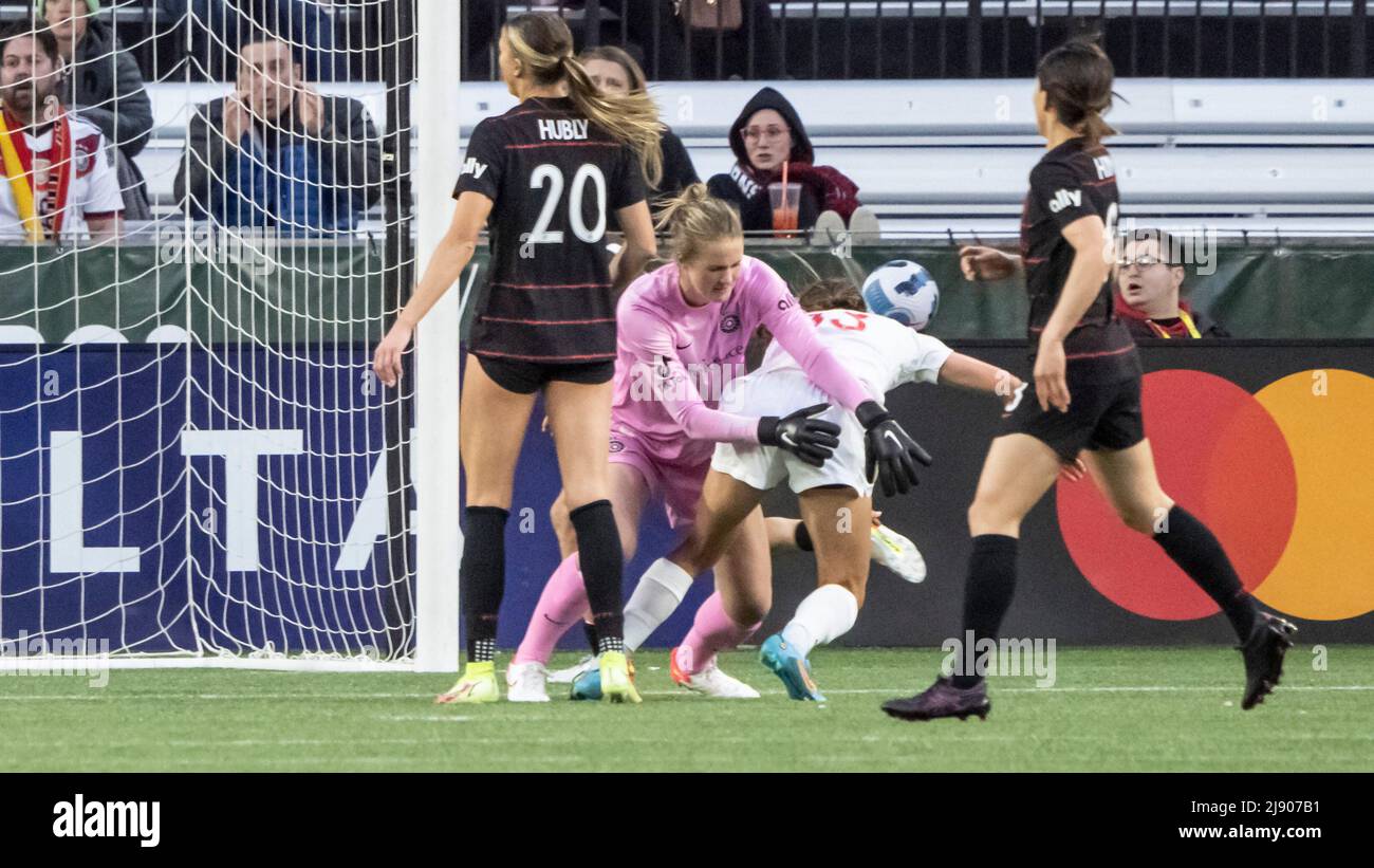 The Thorns' goalie Bella Bixby gets tangled up with Spirit forward ...