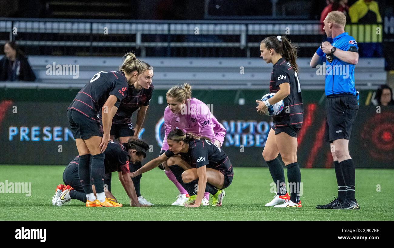 The Thorns' Emily Menges recovers from being tackled with the support ...