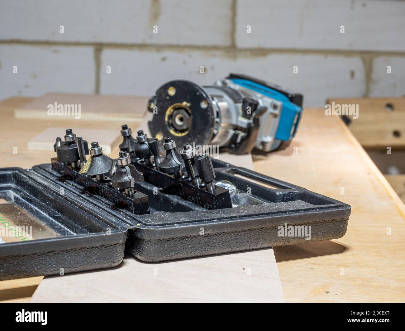 black plastic case of carbon steel tempered router bits with cordless ...