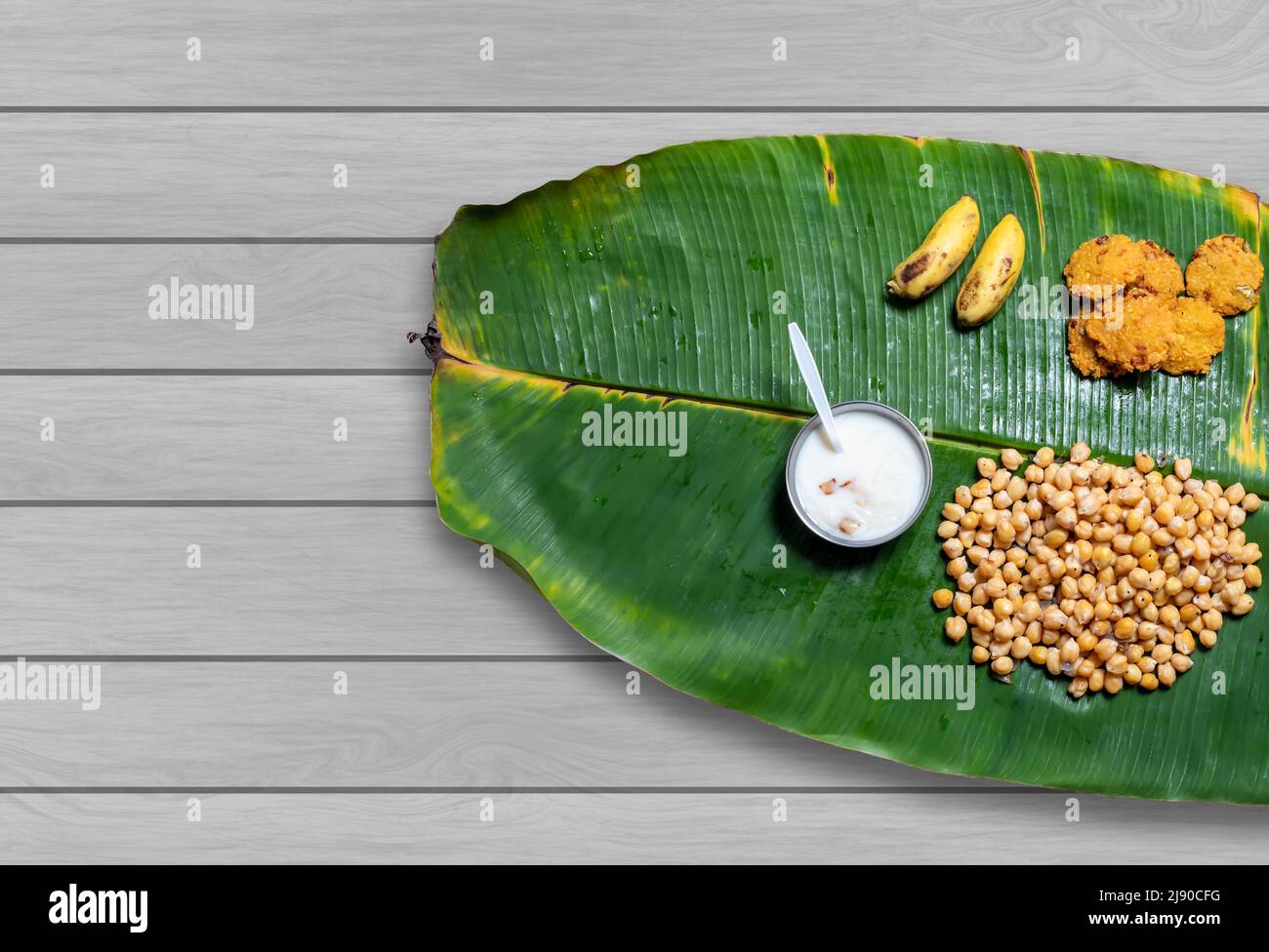 Traditional dish served on banana leaf on Indian festival day. It is ...