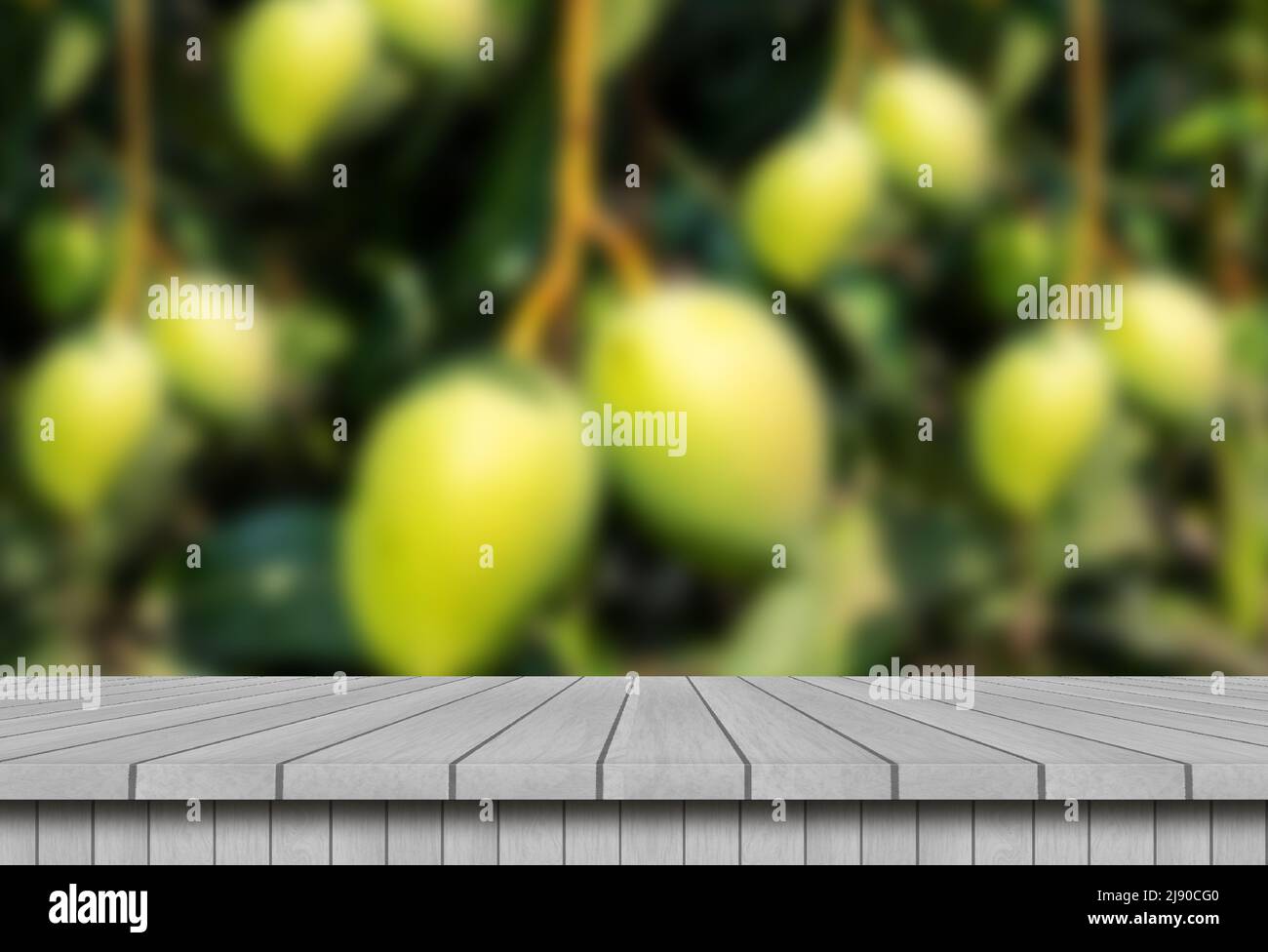 Empty wooden table with blur mango farm backgrounds Stock Photo - Alamy