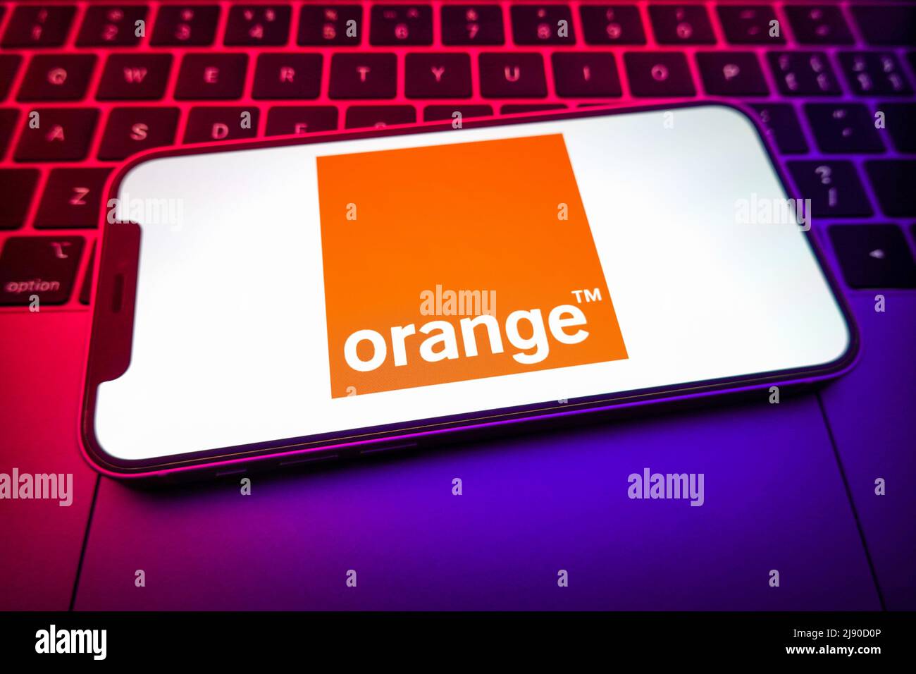 In this photo illustration, an Orange company logo is displayed on the ...