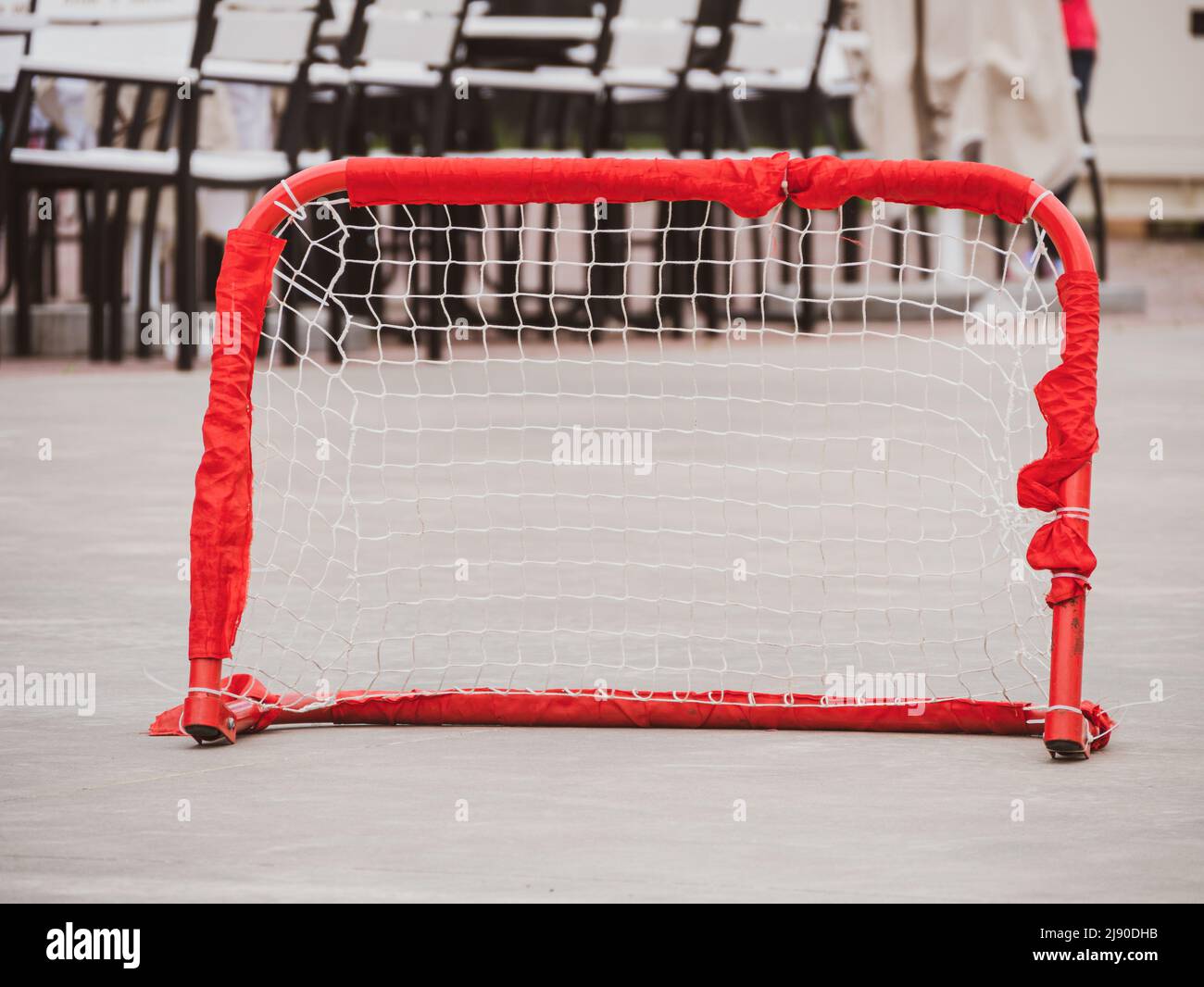 Floorball goal ready for training. Children playing outdoor in spring ...