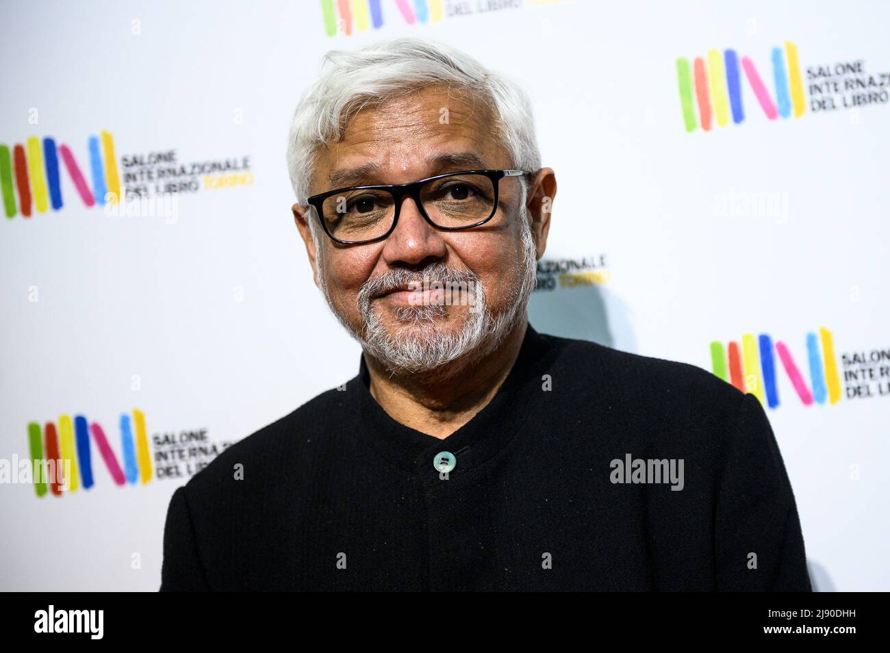 Turin, Italy. 19 May 2022. Indian writer Amitav Ghosh poses for a photo ...