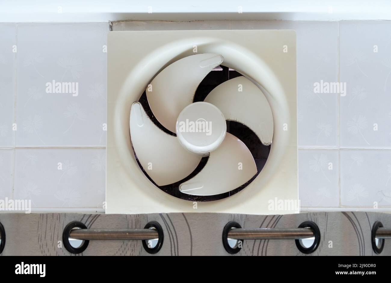 The dirty ventilation fan over the kitchen door in the urban house for ...