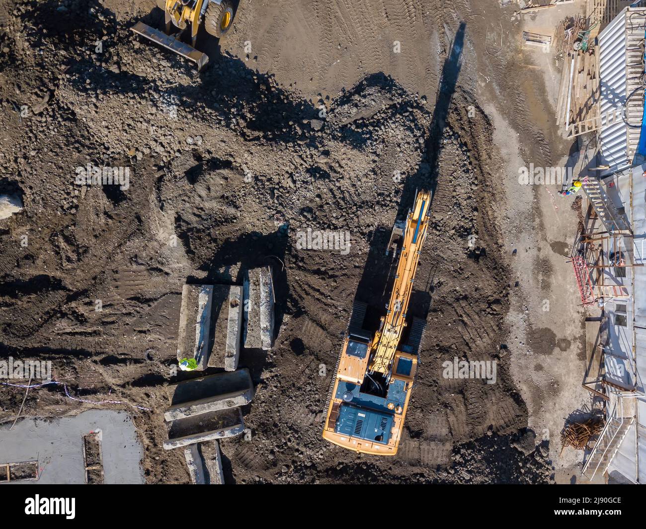 Drone view of a construction site, excavator, tractor. Aerial ...
