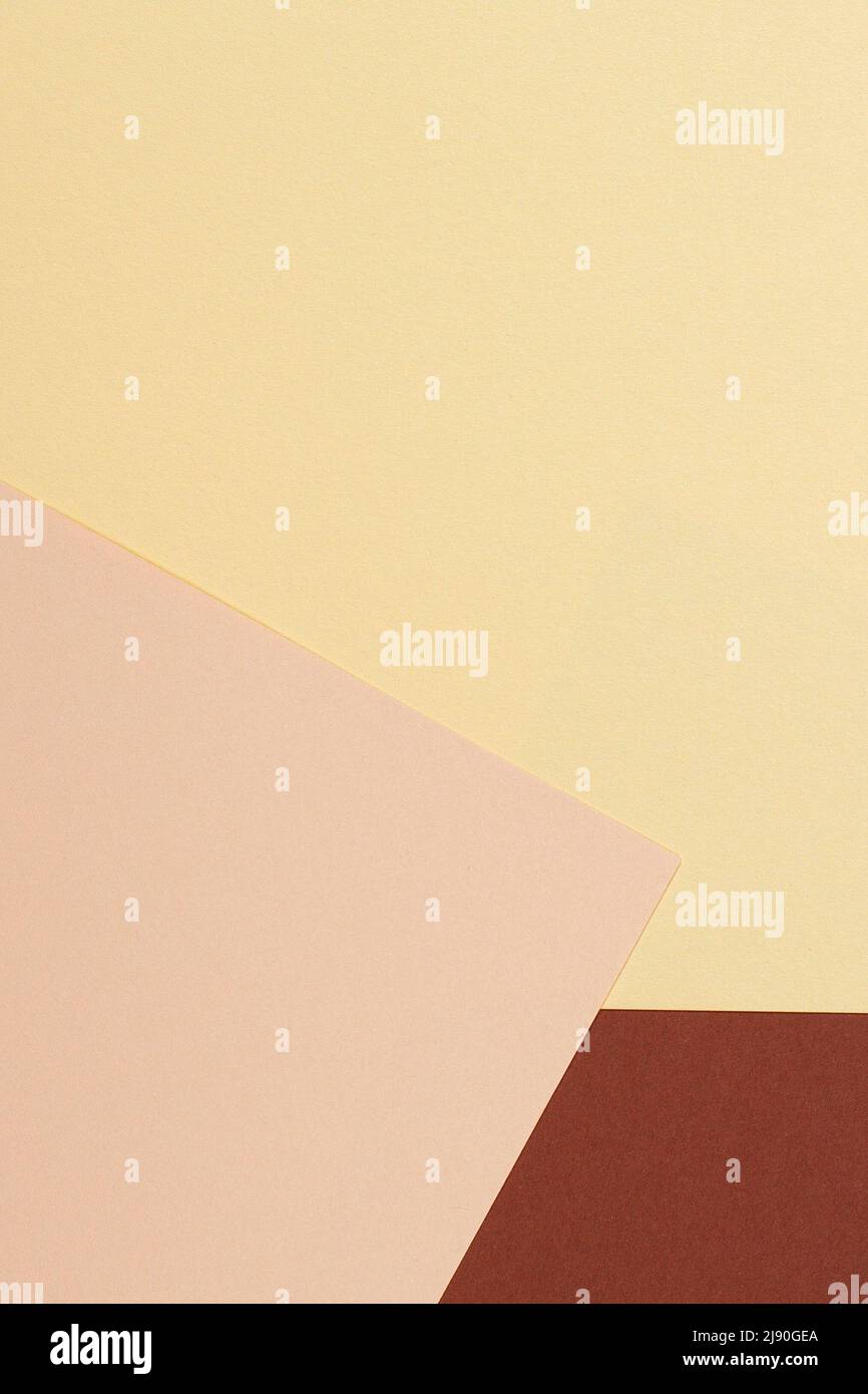 Color papers geometry vertical composition background with yellow beige ...