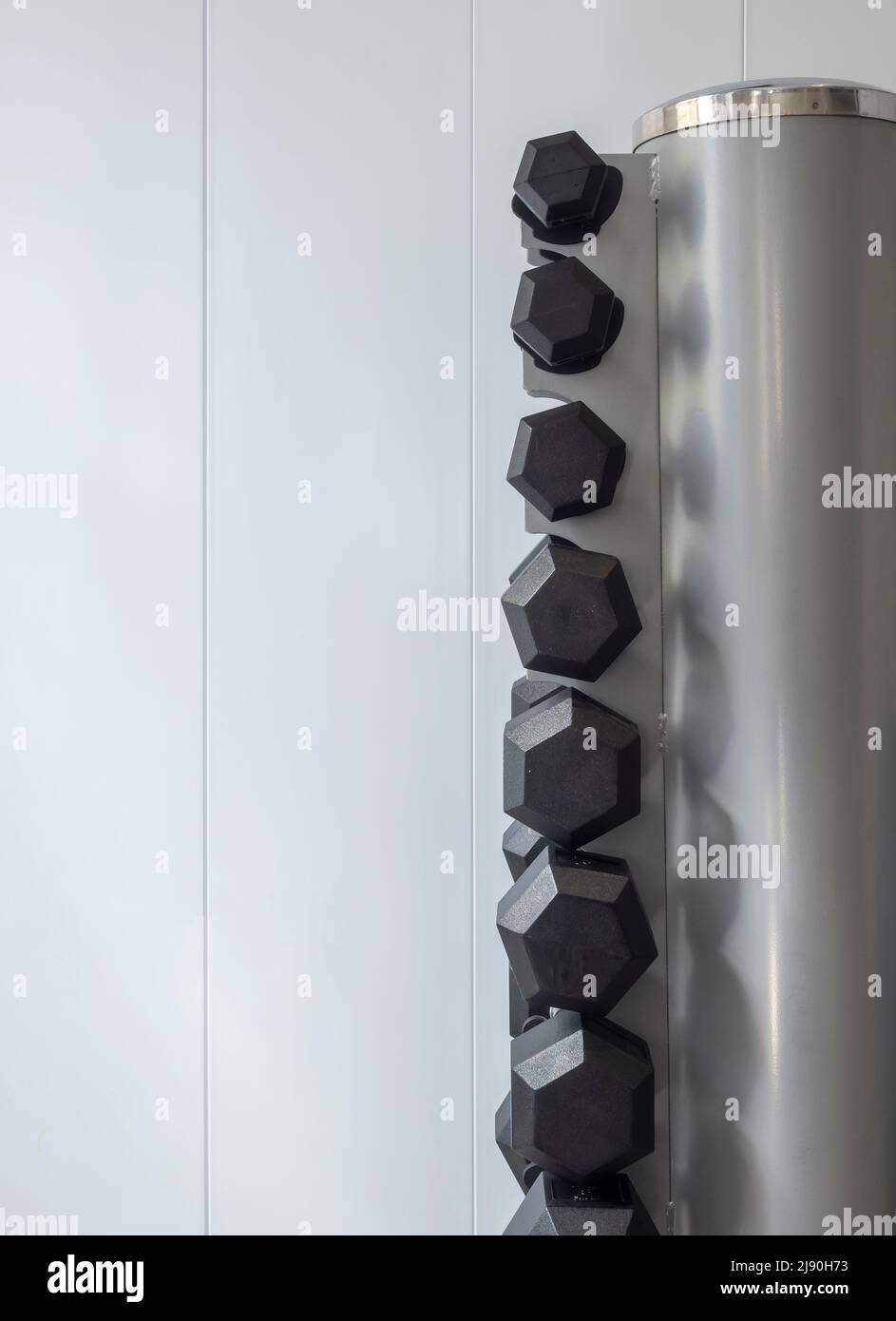 Weights arranged in a gymnasium. Material to exercise the muscles. Gym ...