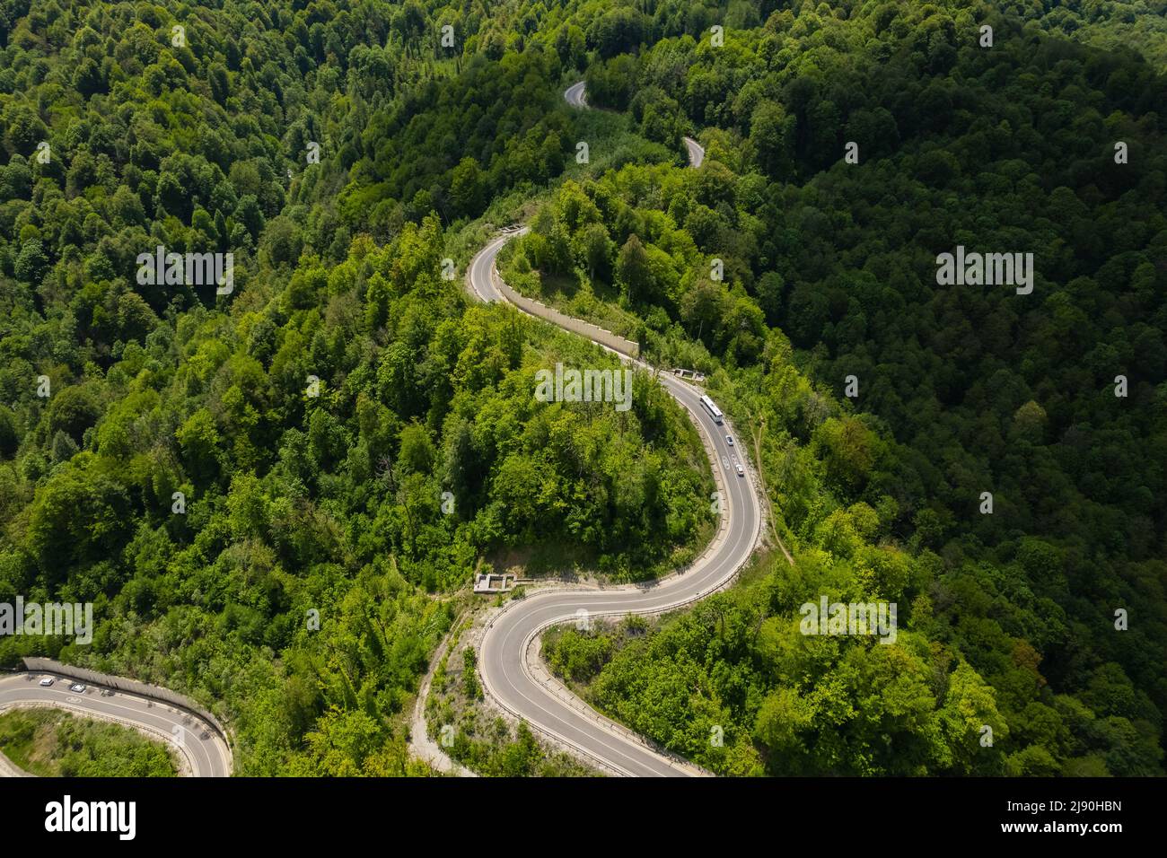 Aerial view of cars on a curvy road in mountain Stock Photo - Alamy