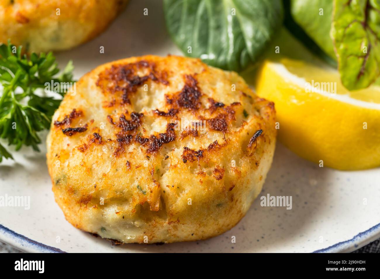 Homemade Fried Crab Cakes with Salad and Tartar Sauce Stock Photo - Alamy