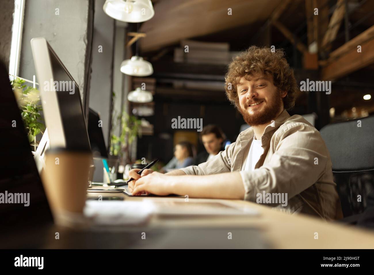 Senior developer. Happy man looking at camera and smilling. Work in ...