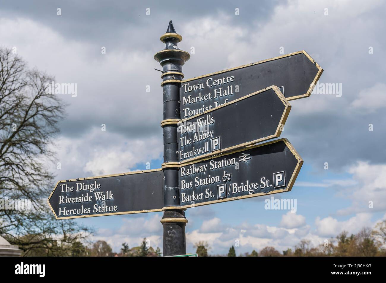The image is of finger post street signs in the historic city of ...