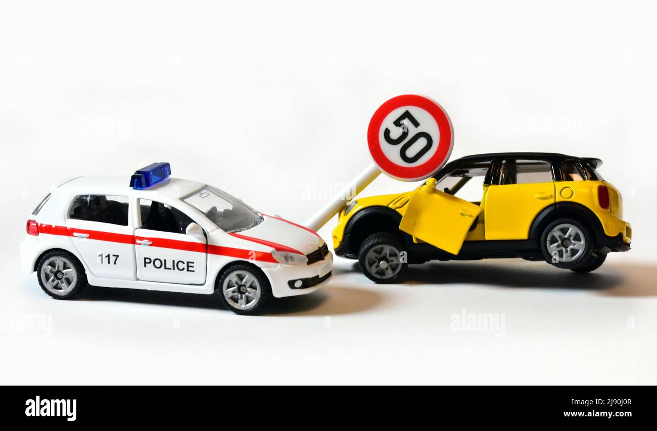 police toy car with mini accident and road sign Stock Photo - Alamy