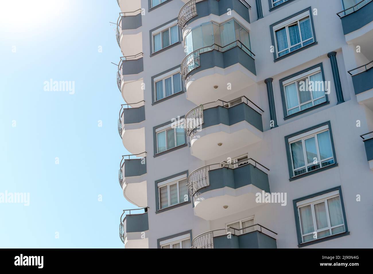 Light effects of sun rays on city buildings. Fragment of a modern ...