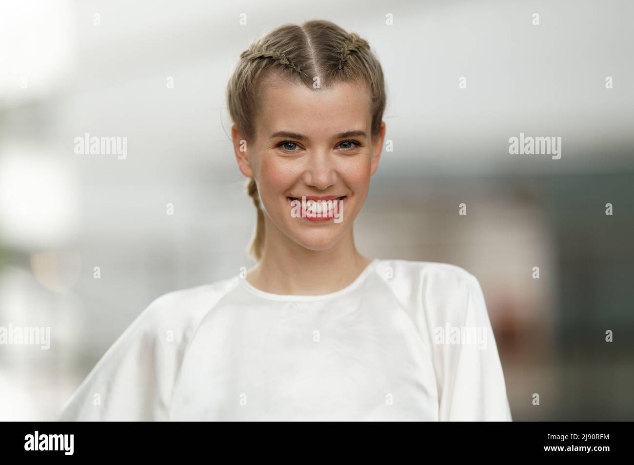 Cologne, Germany. 19th May, 2022. Actress Sina Zadra stands at a press ...