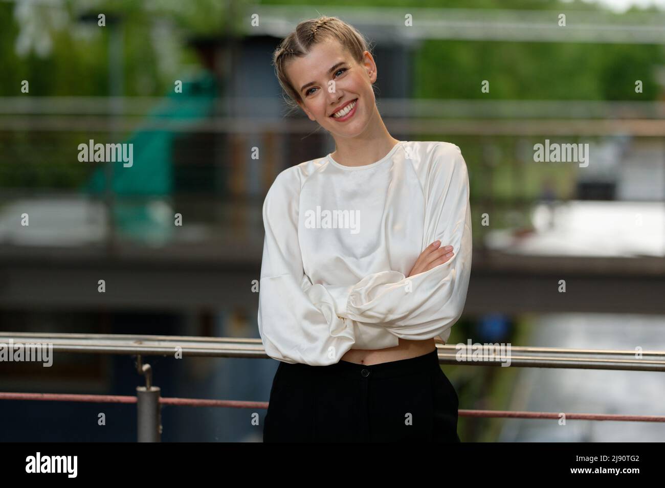 Cologne, Germany. 19th May, 2022. Actress Sina Zadra stands at a press ...