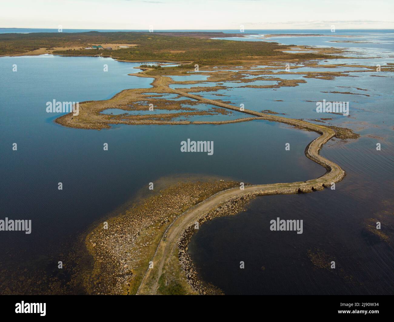 Stone dam-road on Solovki. Road through the White Sea. Big Muksalma ...