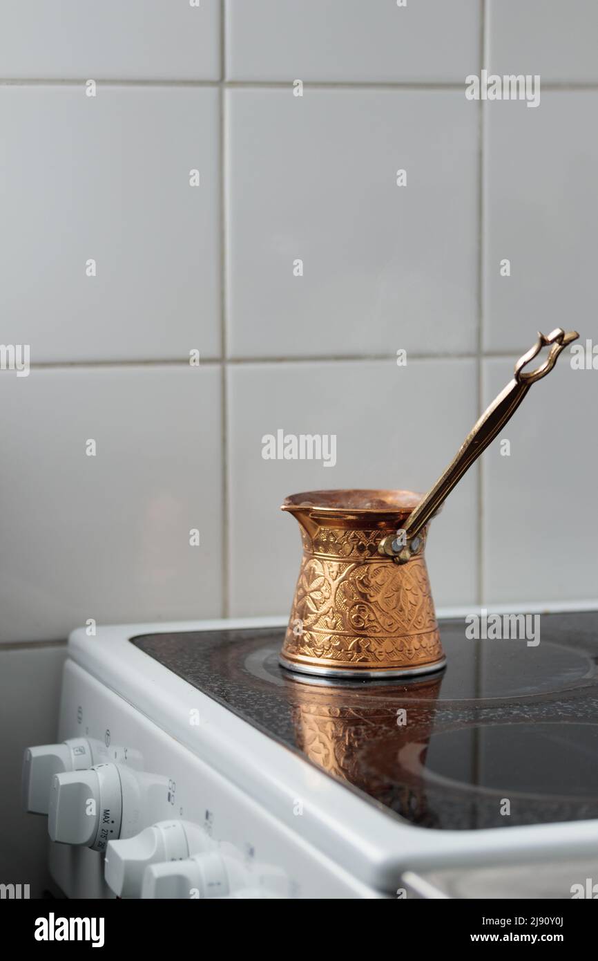 Turkish coffeein a cezve on a stove Stock Photo - Alamy