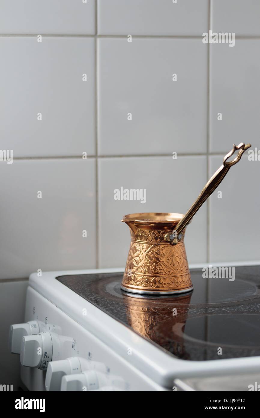 Turkish coffeein a cezve on a stove Stock Photo - Alamy