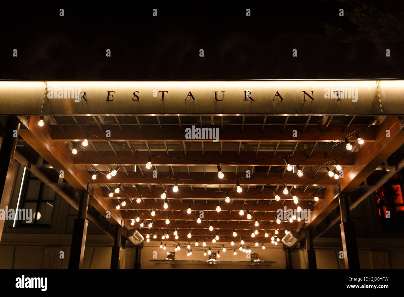 Night view of a restaurant with lots of lights Stock Photo - Alamy
