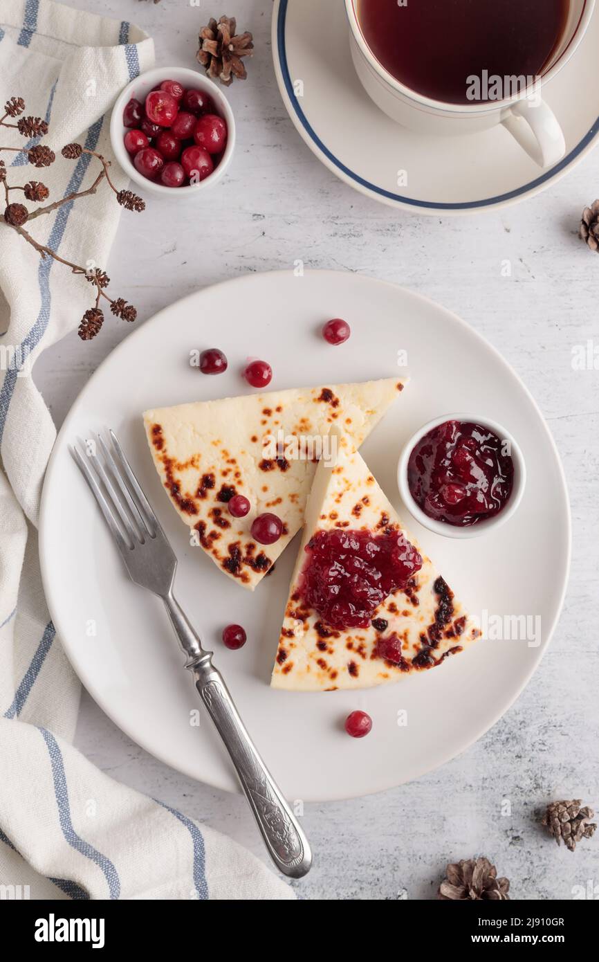 Leipajuusto - traditional Finnish baked cheese - with red berries in a ...