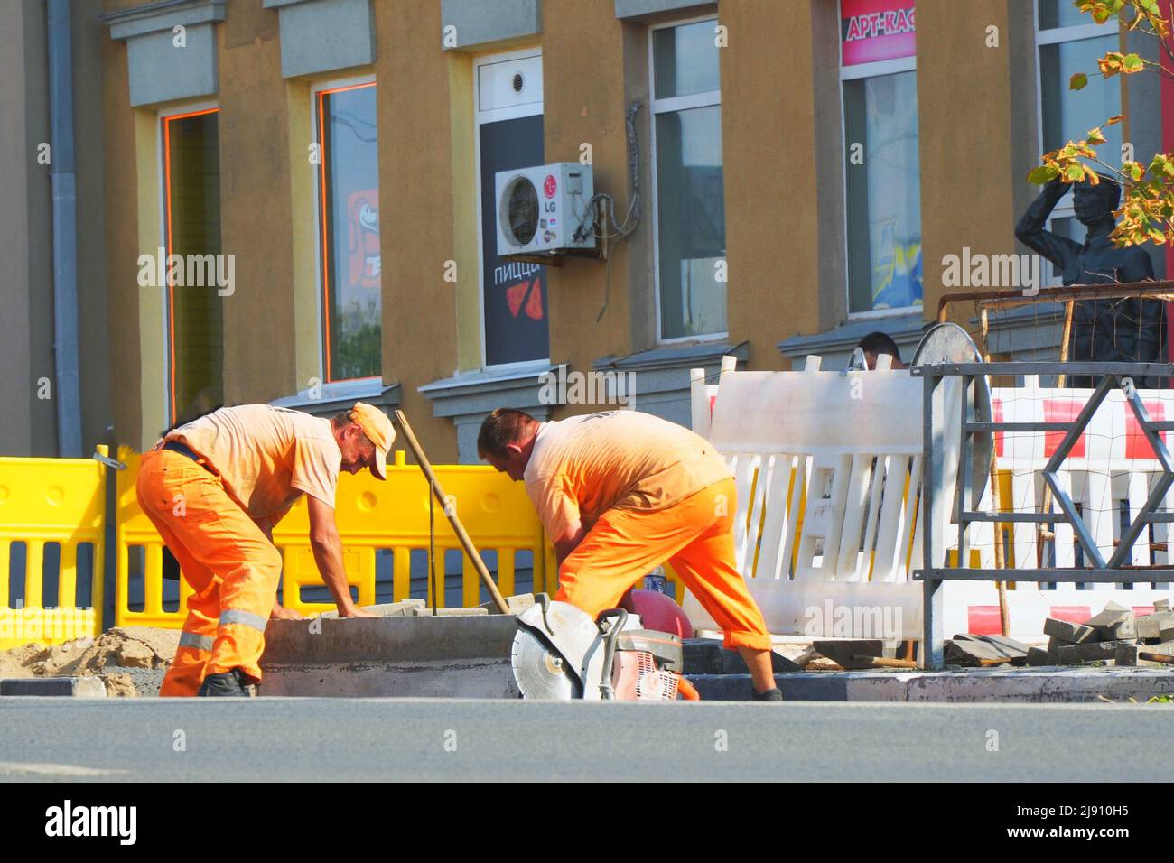 Samara, Russia - circa March, 2022: Uniformed road workers work on a ...