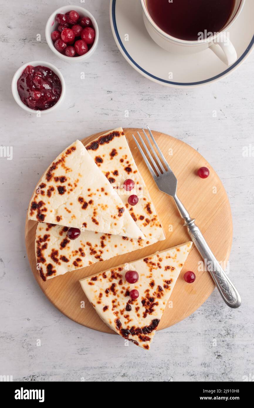Leipajuusto - traditional Finnish baked cheese - with red berries Stock ...