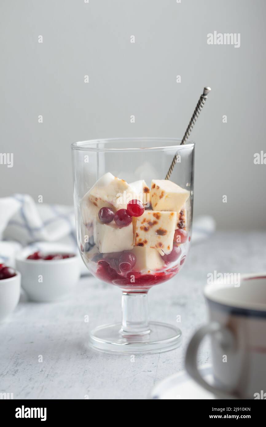 Leipajuusto - traditional Finnish baked cheese - with berries in a ...