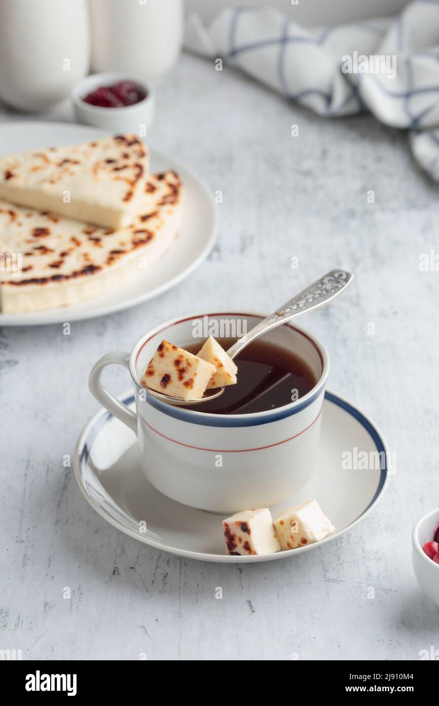 Coffee with Leipajuusto - traditional Finnish baked cheese on a table ...