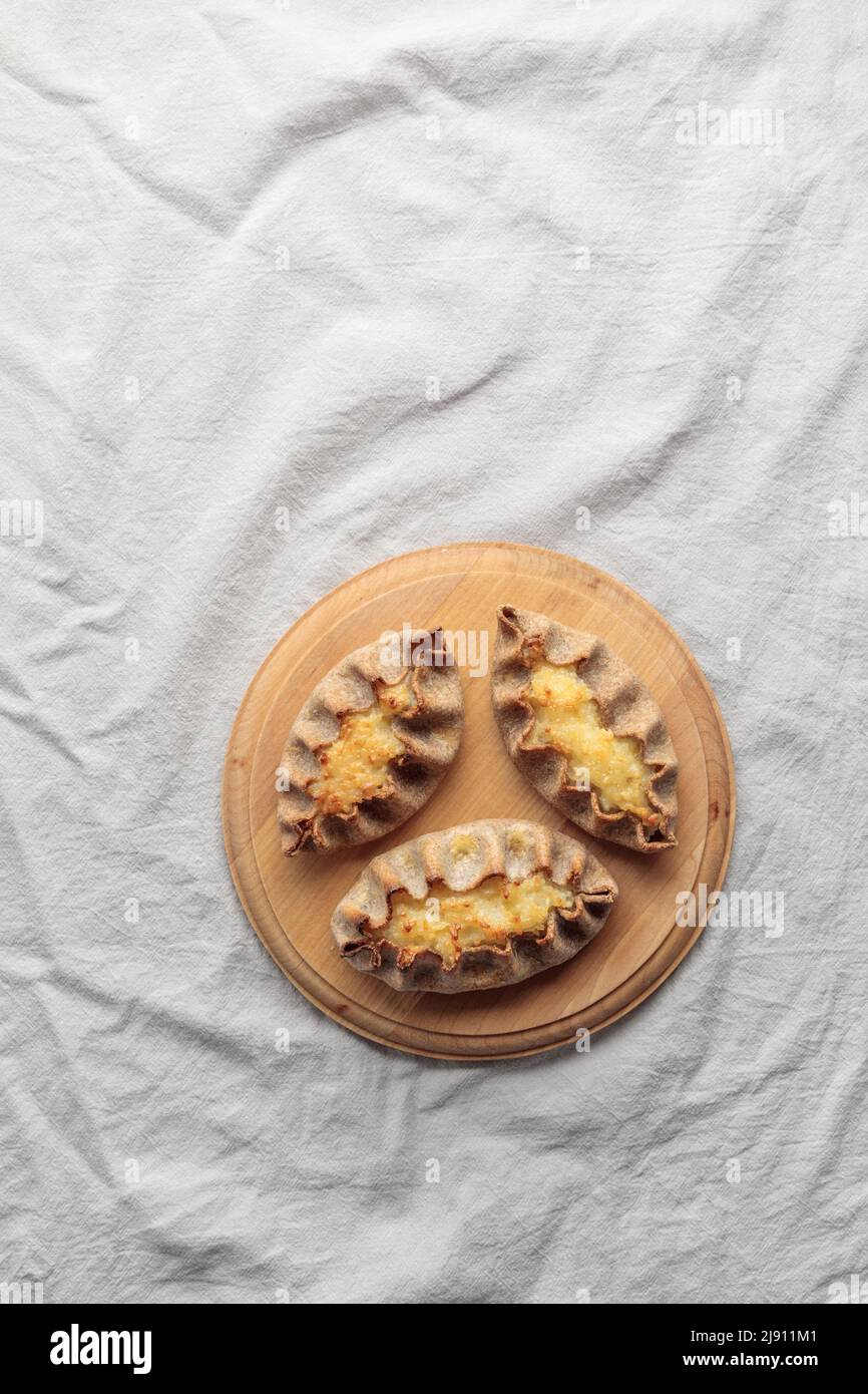 Traditional Finnish pastry - Karelian rye pie with rice porridge and on ...