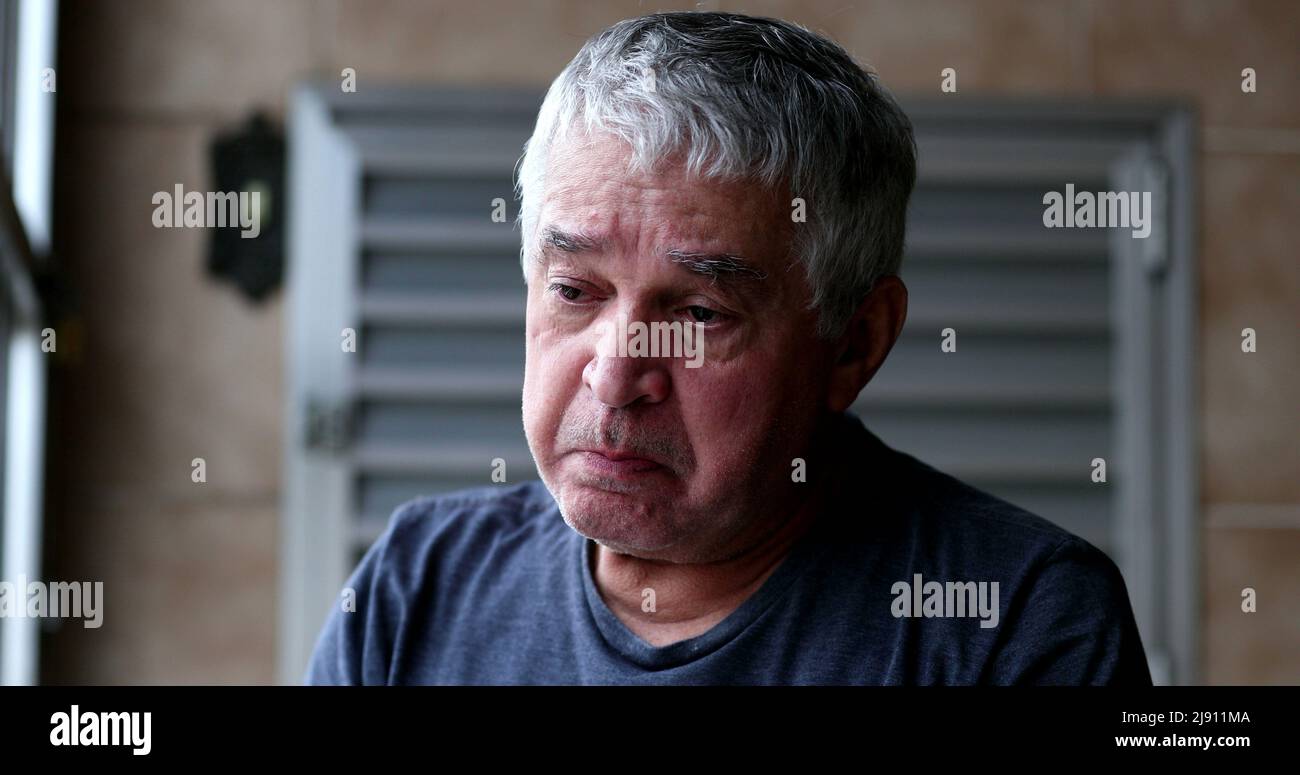 Angry sad middle aged man crying wiping tears Stock Photo - Alamy