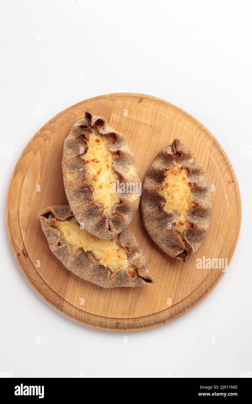 Traditional Finnish pastry - Karelian rye pie with rice porridge and on ...