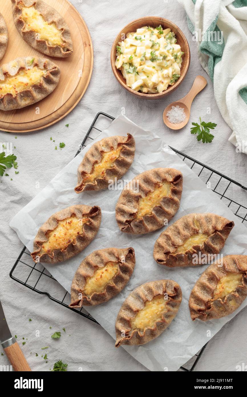 Traditional Finnish pastry - Karelian rye pie with rice porridge and an ...