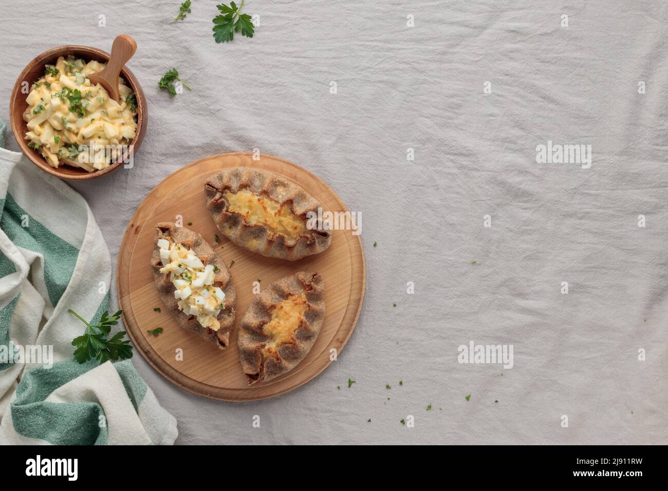 Traditional Finnish pastry - Karelian rye pie with rice porridge and an ...