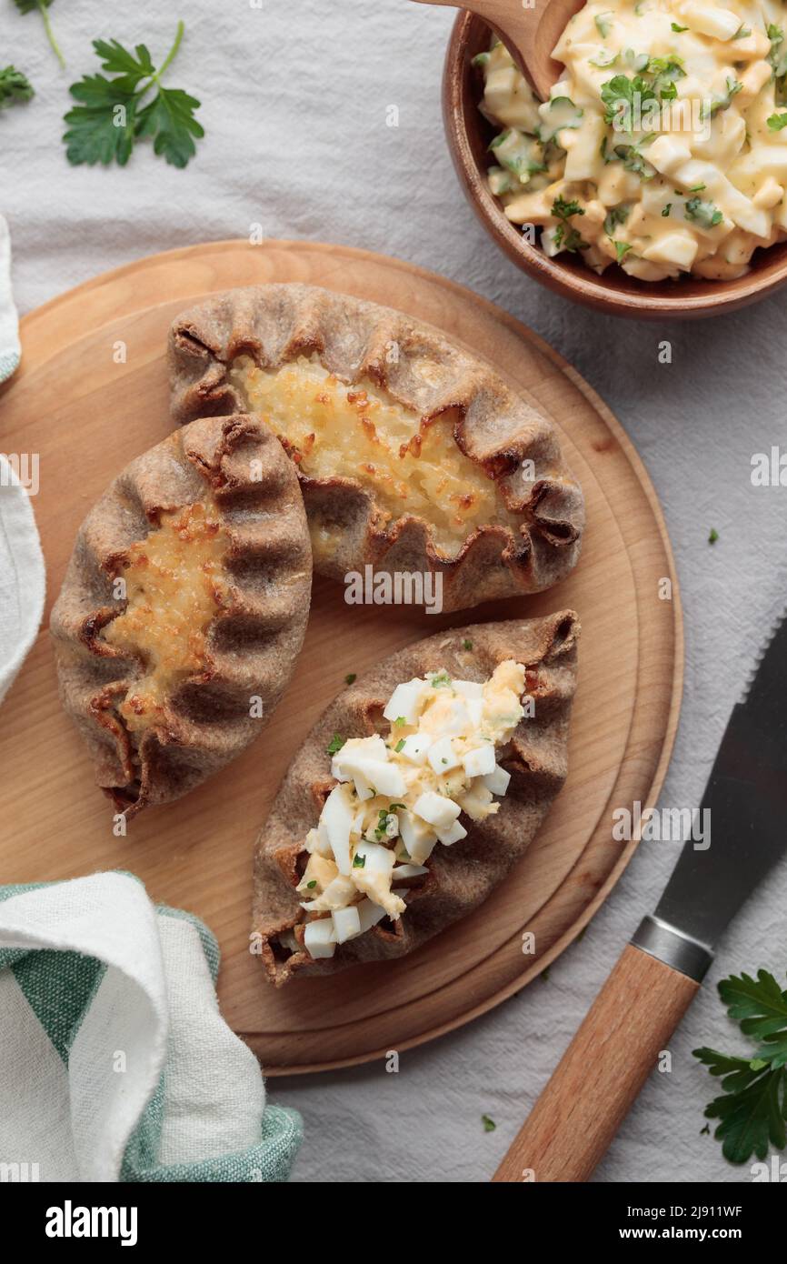 Traditional Finnish pastry - Karelian rye pie with rice porridge and an ...