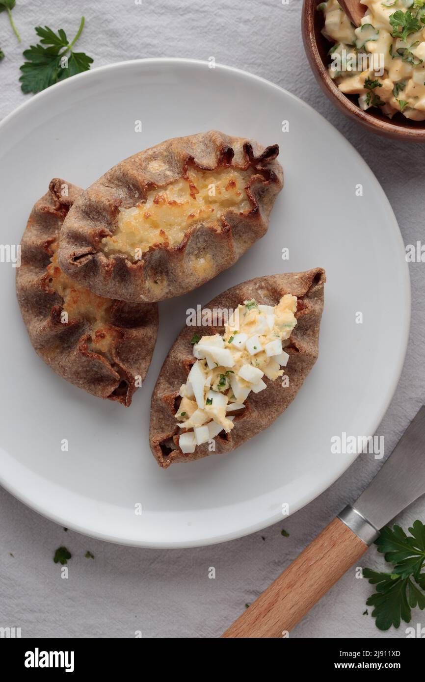 Traditional Finnish pastry - Karelian rye pie with rice porridge and an ...